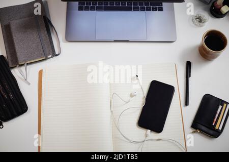 View of desk with diary and cell phone Stock Photo - Alamy