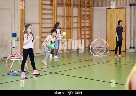 Children having PE class in school gym Stock Photo - Alamy