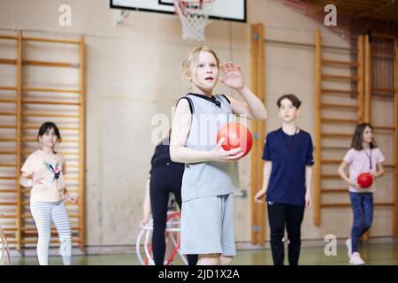 Children having PE class in school gym Stock Photo - Alamy