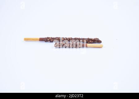 Chocolate covered cracker stick on a white background Stock Photo - Alamy