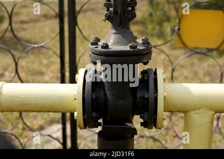 Yellow gas pipes and valves outdoors. gas equipment. Copy space for ...