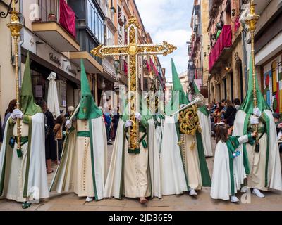 Cofrades in their traditional costumes with capirote, parading through ...