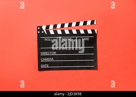 Photo of movie clapper on red background Stock Photo - Alamy