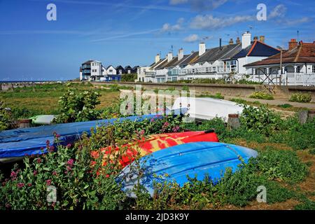 UK, Kent, Whitstable Beach, Overturned Boats and Apartments Stock Photo ...