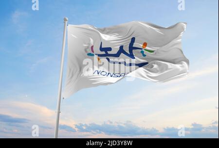 official flag of Nonsan city, South Korea at cloudy sky background on ...