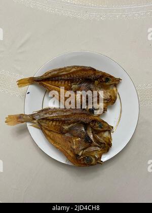 Photo of katambak or dried sweetlip emperor fish served on a plate ...