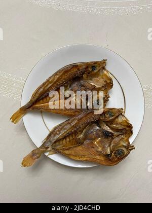 Photo of katambak or dried sweetlip emperor fish served on a plate ...