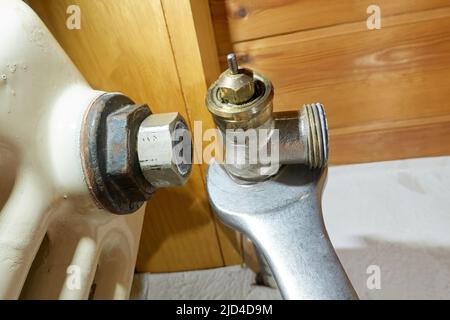 Replace old radiator thermostat valve. Tool removes component from the ...