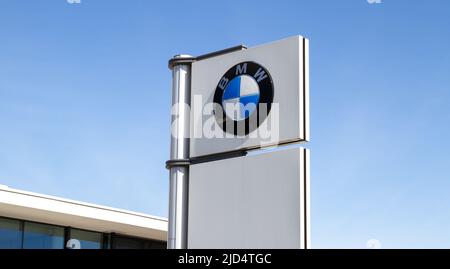 Sign with the logo of BMW AG. Bayerische Motoren Werke is a German ...