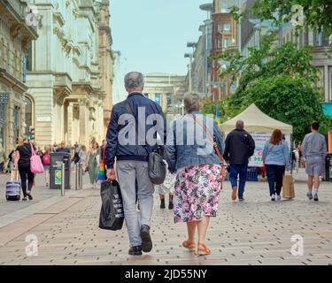 Glasgow, Scotland, UK June 18th 2022. UK Weather: Pedestrian walking ...