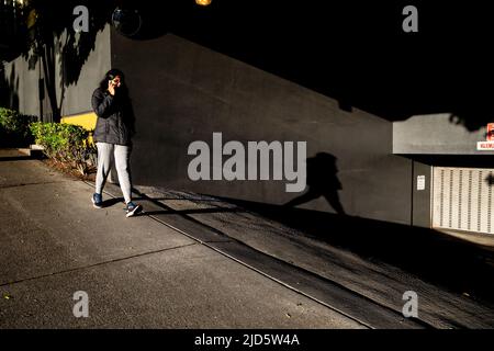 Seattle, USA. 8 Jun, 2022. Shadows and travelers at the Gum Wall in ...
