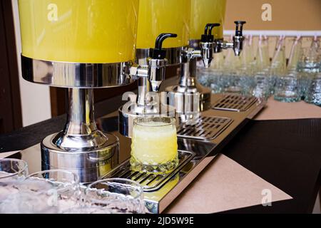 Catering table with alcoholic and non-alcoholic drinks, dishes and ...