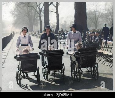 Children wheeled in their perambulators by professional nurses in ...