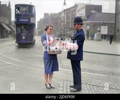 A girl sells an Alexandra rose for charity to a London traffic ...