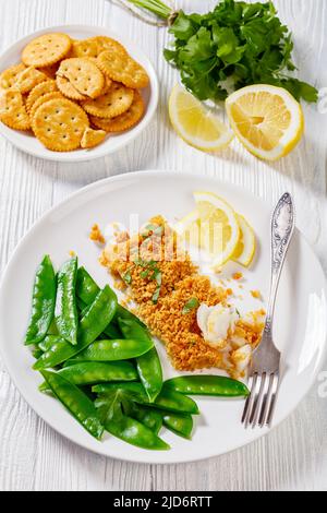 Baked Haddock with Crackers butter toppings served with boiled snow ...