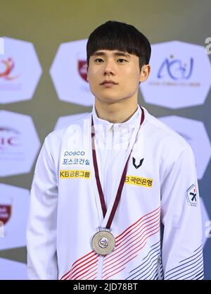 Doha. 18th June, 2022. Silver medalist Kim Hansol of South Korea reacts ...