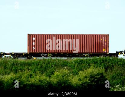 UES shipping container on a Freightliner train, Warwickshire, UK Stock ...