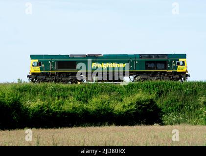 Freightliner class 66 diesel locomotive pulling intermodal freight ...