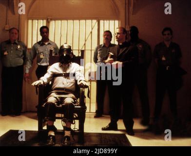 MAN IN ELECTRIC CHAIR, SWITCHING CHANNELS, 1988 Stock Photo - Alamy