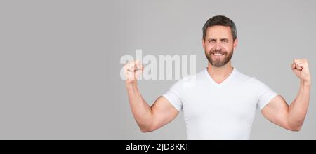 I am strong. Strong man grey background. Fit guy show strength. Muscle ...