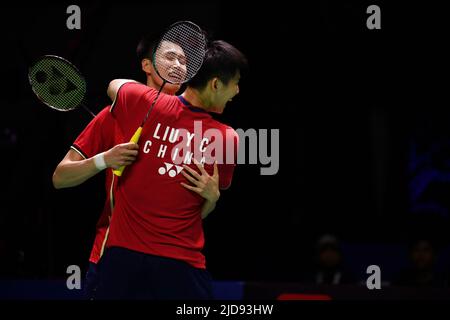 South Korea's Won Ho Kim, right, and Seung Jae Set play Singapore' s Koh Eng Keat Wesley and ...