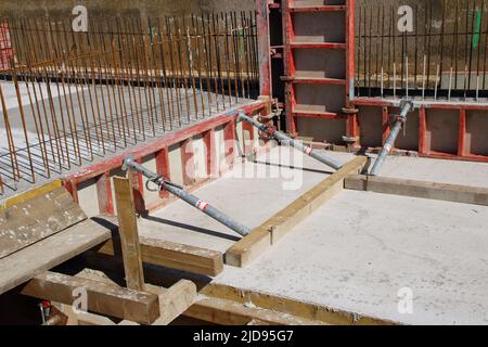 Formwork for a concrete wall was secured against slipping with struts ...