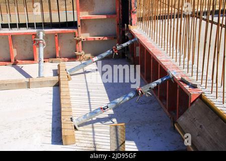 Formwork for a concrete wall was secured against slipping with struts ...
