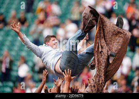 A pitch invader is thrown into the air by the Barbarians players after ...