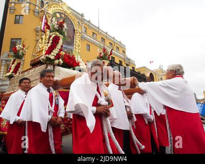 Devotees carrying a religious litter when hundreds of Quechua-speaking ...