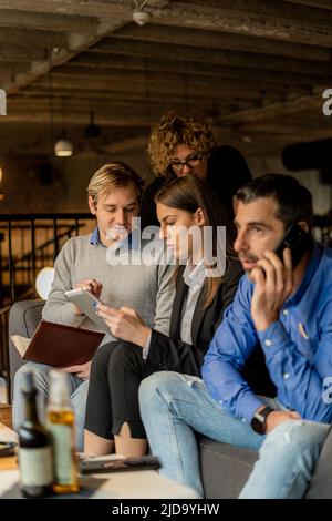 Four amazing business people are making plans and ideas while walking ...
