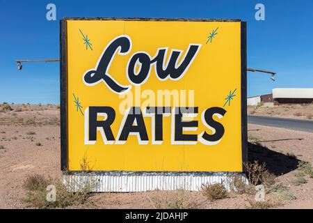 LOW RATES billboard, yellow sign, advertising, close up Stock Photo - Alamy