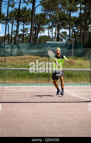 Tennis player performing a drop shot on court Stock Photo - Alamy