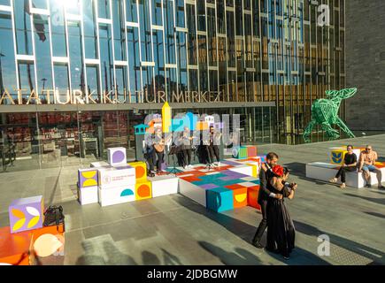 Band performing and couple dancing tango in front of Ataturk Cultural ...