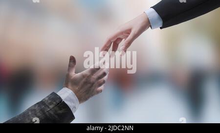 Businessman giving a handshake to a failed jobless business executive ...