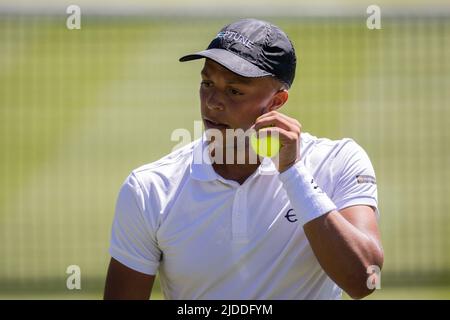 Jay Clarke of Great Britain holding his racket above his head during ...