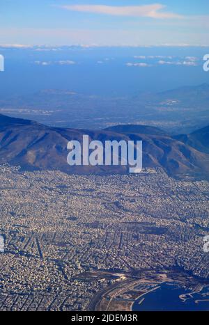 Aerial view of parts of Athens and surrounding mountains, during ...