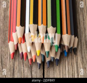 Assorted color pencils over wooden table with copy space Stock Photo ...