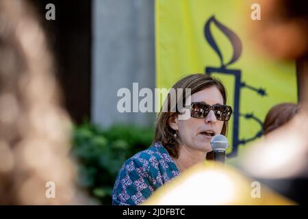 A demonstrator speaks concerning human rights during the protest Stock ...