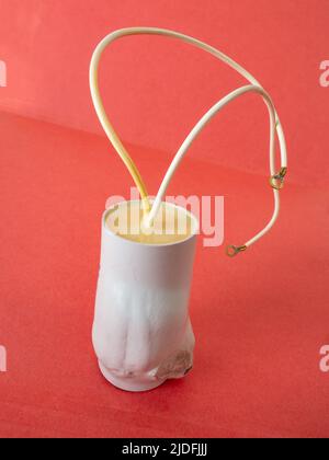 Swollen Electrolytic Capacitor (condenser or condensator) on blue ...