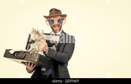 Money makes the man. Happy showman hold suitcase with money. Rich ...