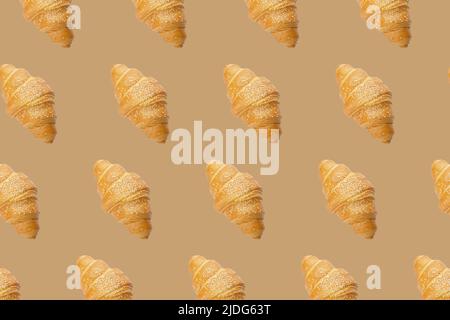 Many fresh croissants on beige background. Pattern for design Stock ...