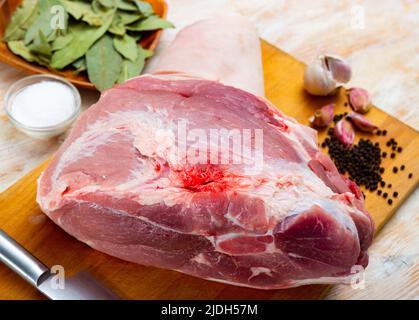 Raw pork leg with herbs and condiments ready for cooking Stock Photo ...