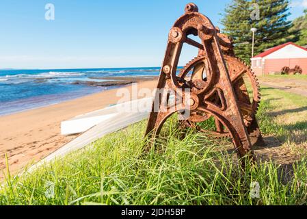 Upturned metal fishing boats (Tinnies) hauled up on the shore at ...