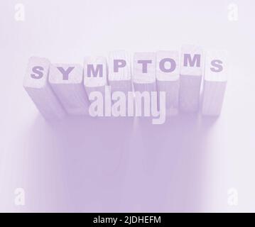 Symptoms word from wooden blocks with letters, viral diseases ...