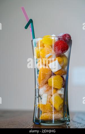 Glass of Frozen Tropical Fruits to prepare a healthy Smoothie Stock ...