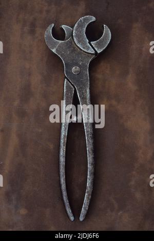 Vintage metal tool with twin heads used for applying tethering rings to ...