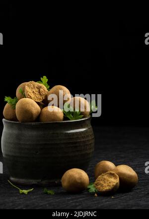 Dankwa, (maize-peanut balls) with parsley Hausa delicacy Stock Photo ...