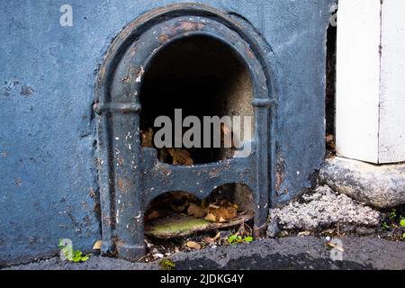Traditional old boot scraper set in outside wall on street in the ...