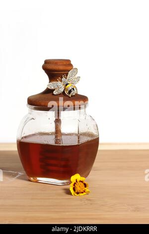 Fresh Local Honey With Orange Wildflowers on White Background Stock ...