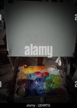 Oil paints ready for mixing on a glass surface with palette knife Stock ...